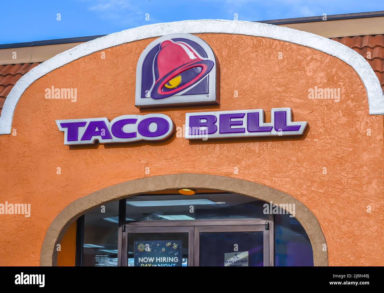 Taco Bell's exterior facade brand and logo signage in purple letters on ...