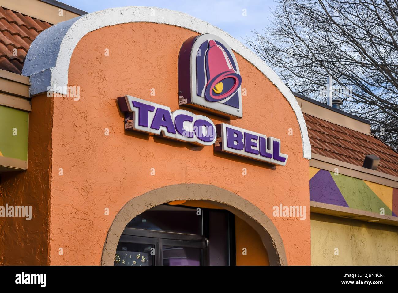 Taco Bell's exterior facade brand and logo signage in purple letters on ... Taco Bell's exterior facade brand and logo signage in purple letters on ...