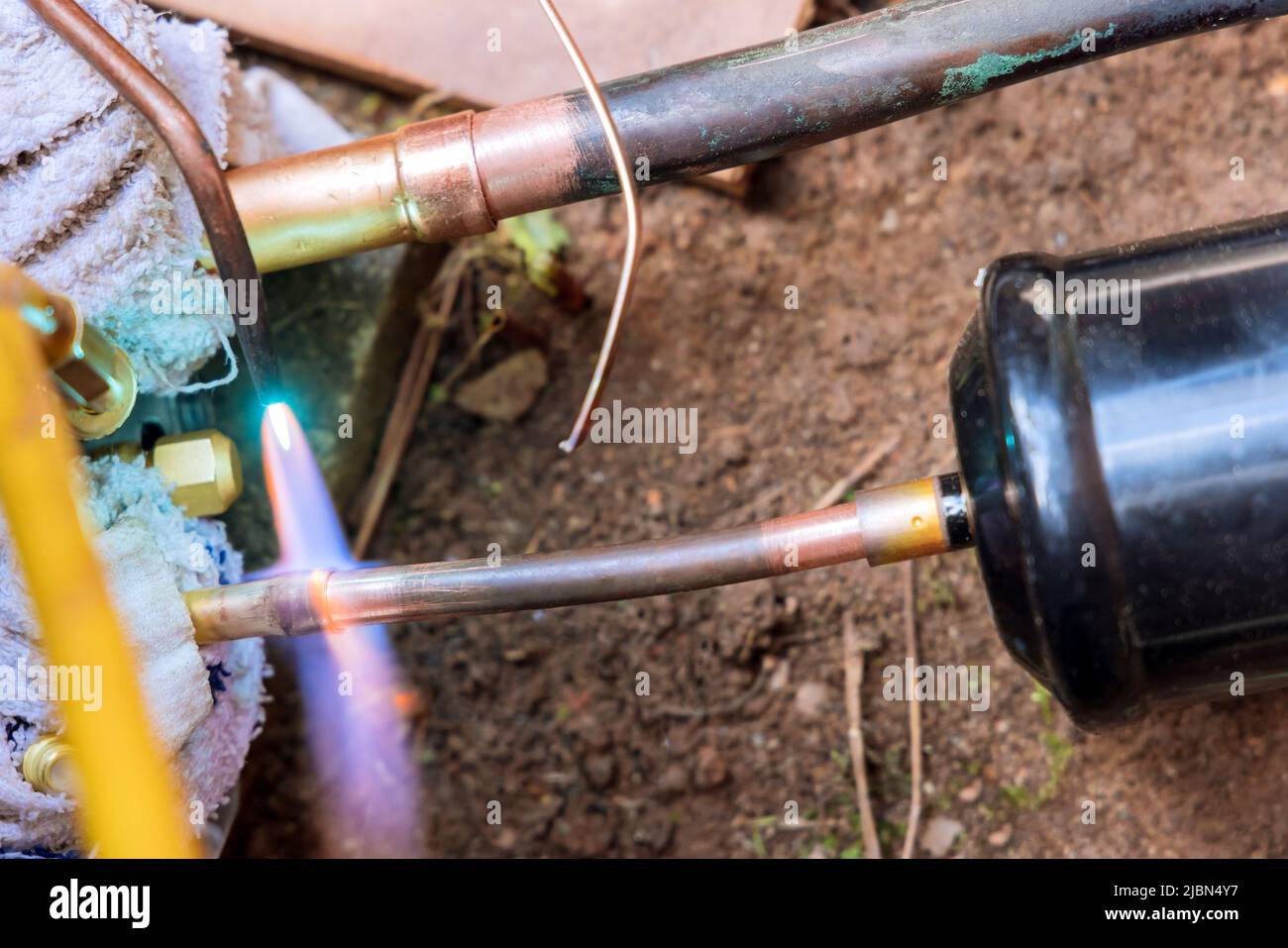 Copper pipe while joining pipe with fitting Stock Photo - Alamy