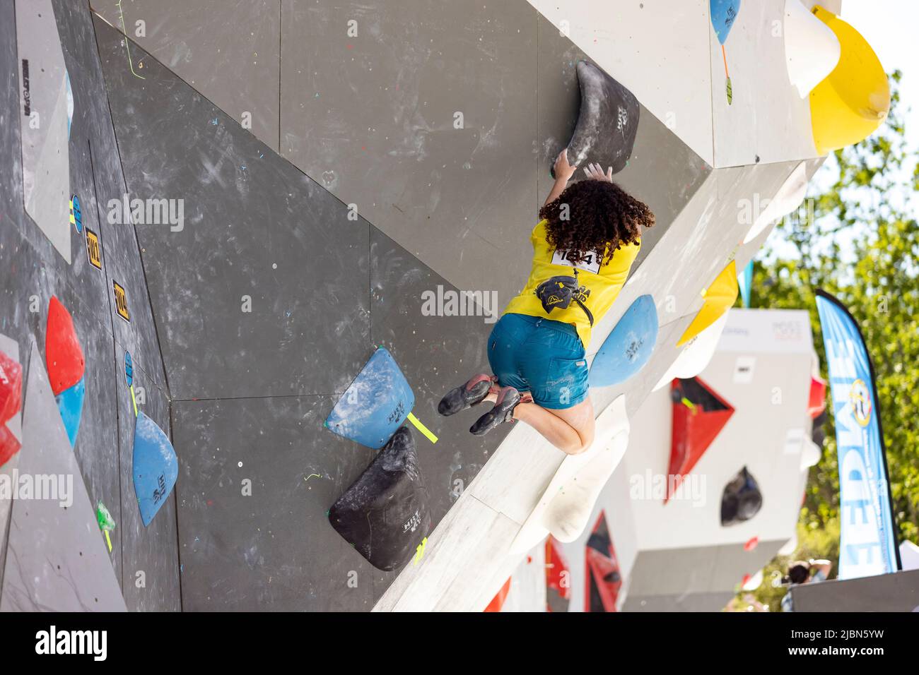 Climbing. Sport. Young person climbing in Block Climbing. Olympic ...