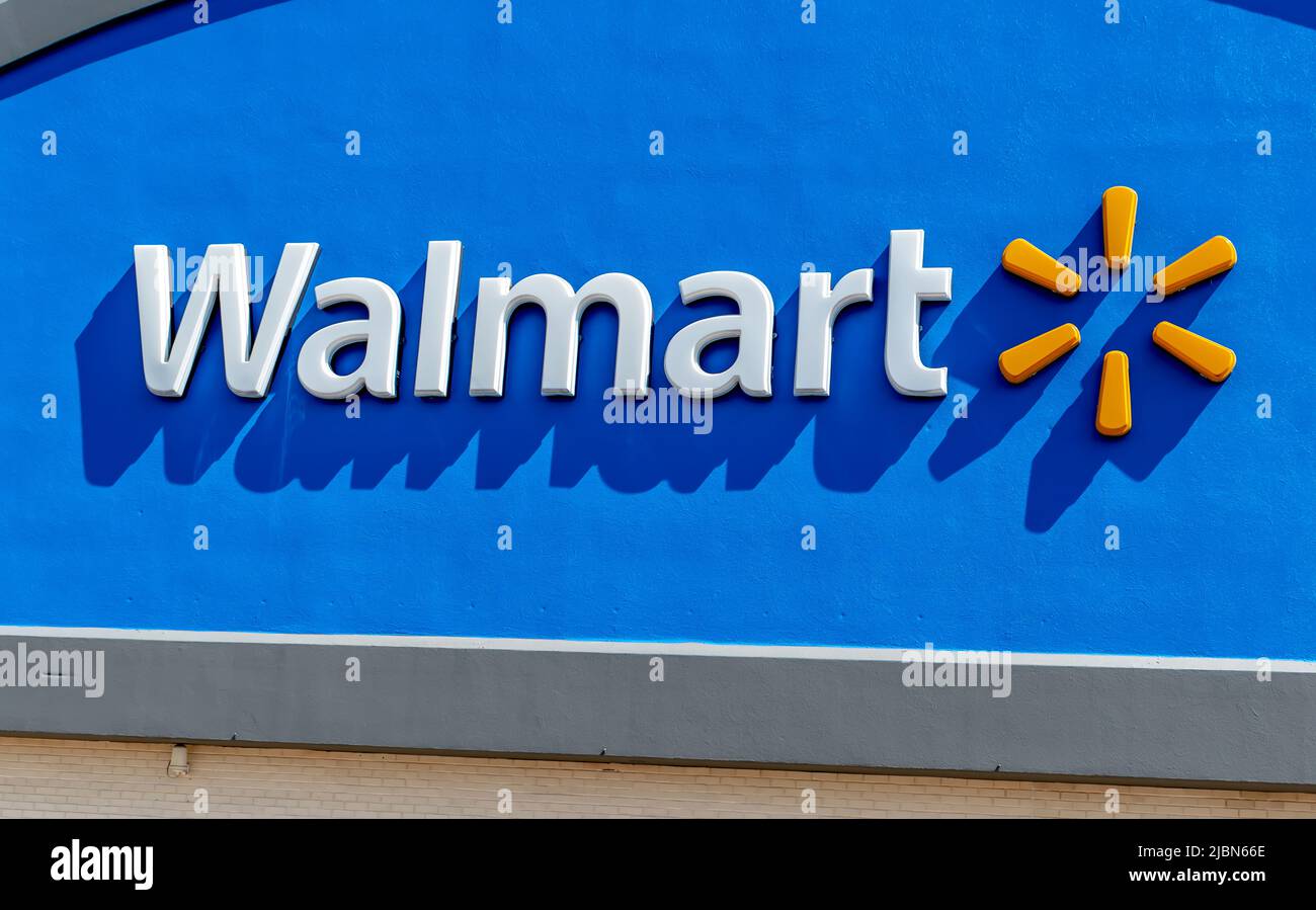 Walmart exterior facade brand and logo signage in white letters with a ...