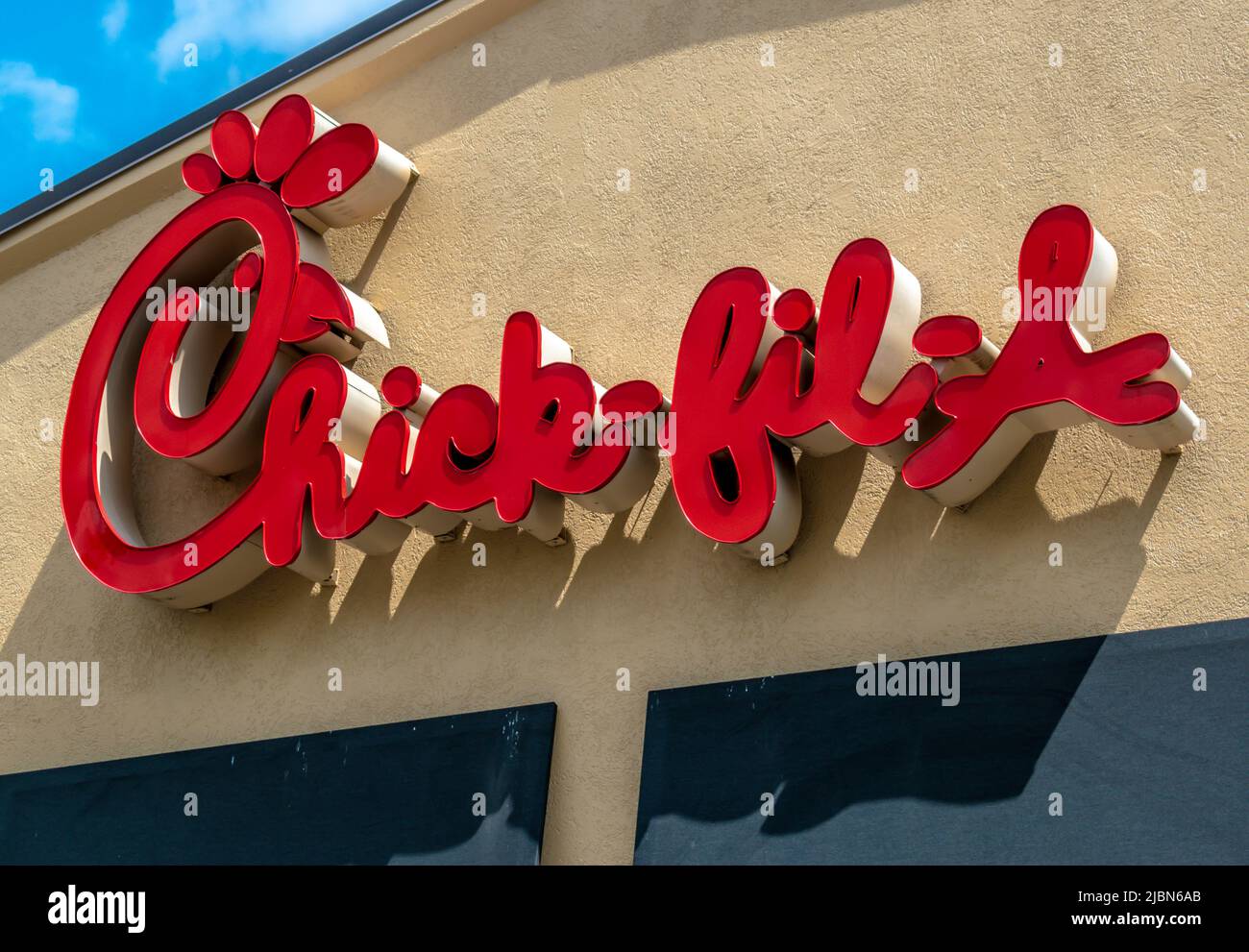 Chick-fil-A exterior facade brand and logo signage in red script ...