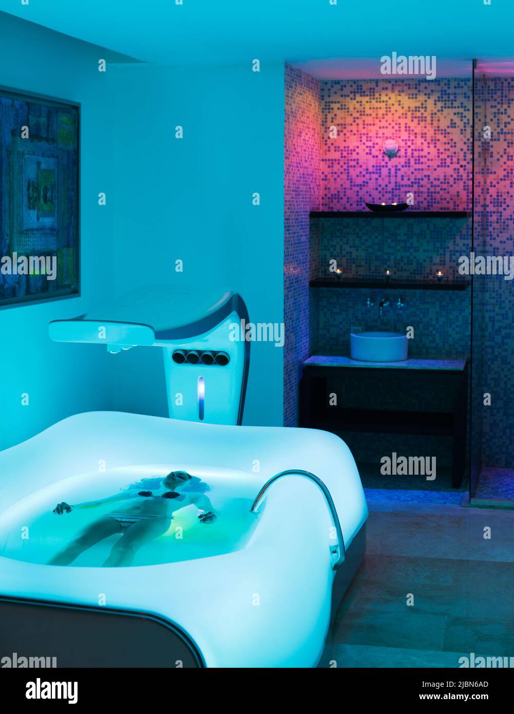 A woman floats in a chromotherapy tub during the Dream State treatment ...
