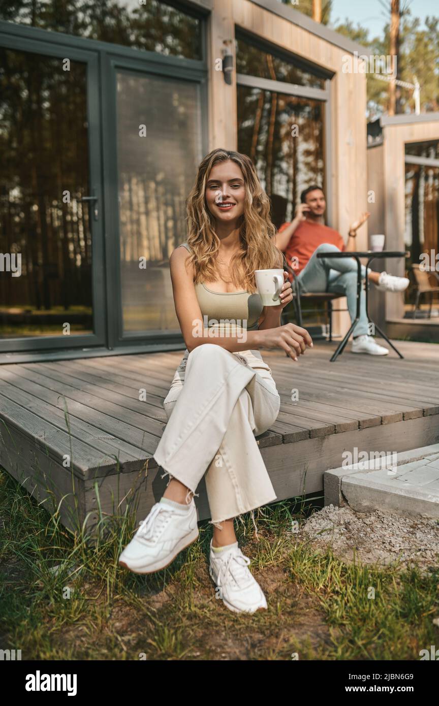 Happy beautiful female and a male on the terrace Stock Photo - Alamy
