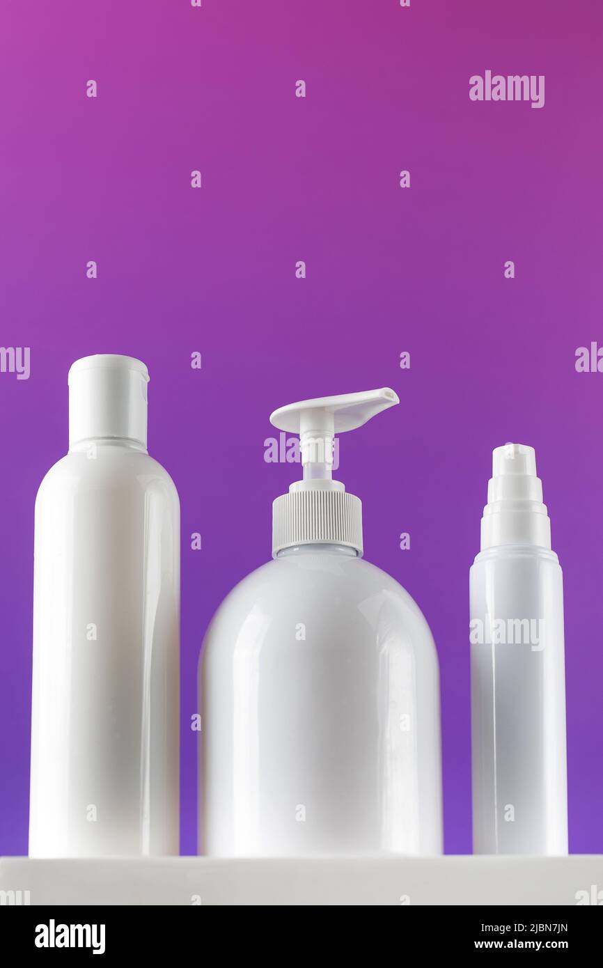 Mockups of white containers with cosmetics on a pedestal. Cosmetics ...