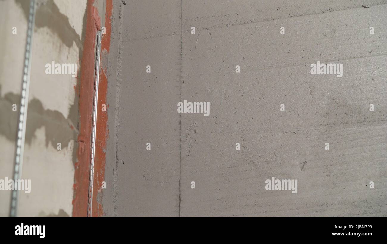 Repair of walls with metal guides. Corner of wall with applied ...