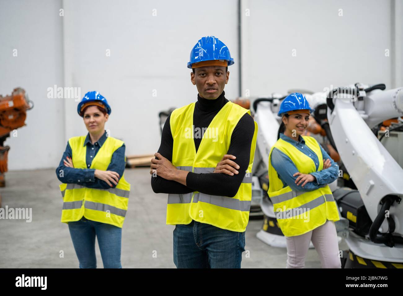 Corporate portrait of three robotic technology engineers Stock Photo ...