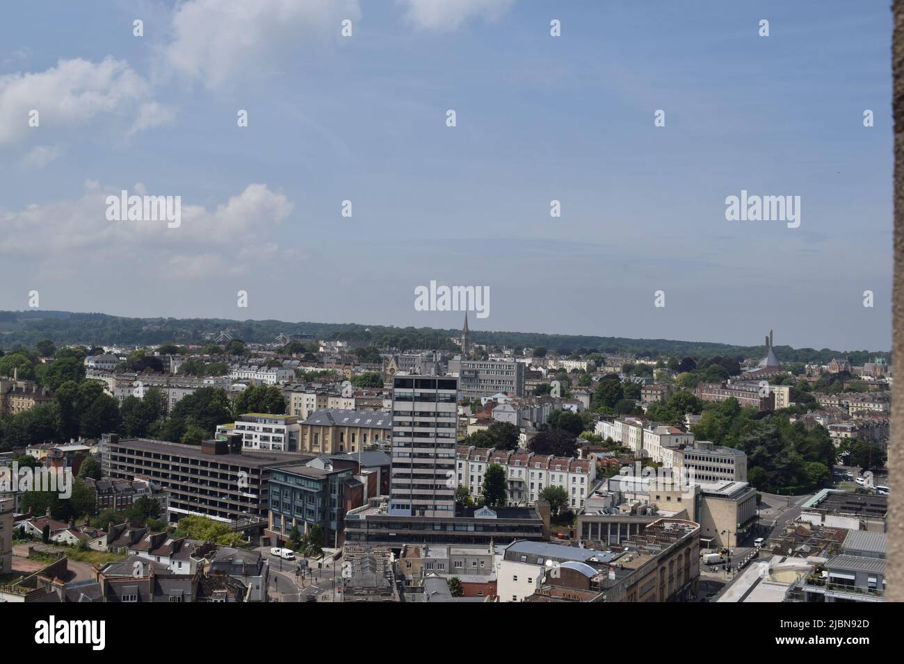 Aerial view of Bristol city during sunny day with sky and clouds. Many ...