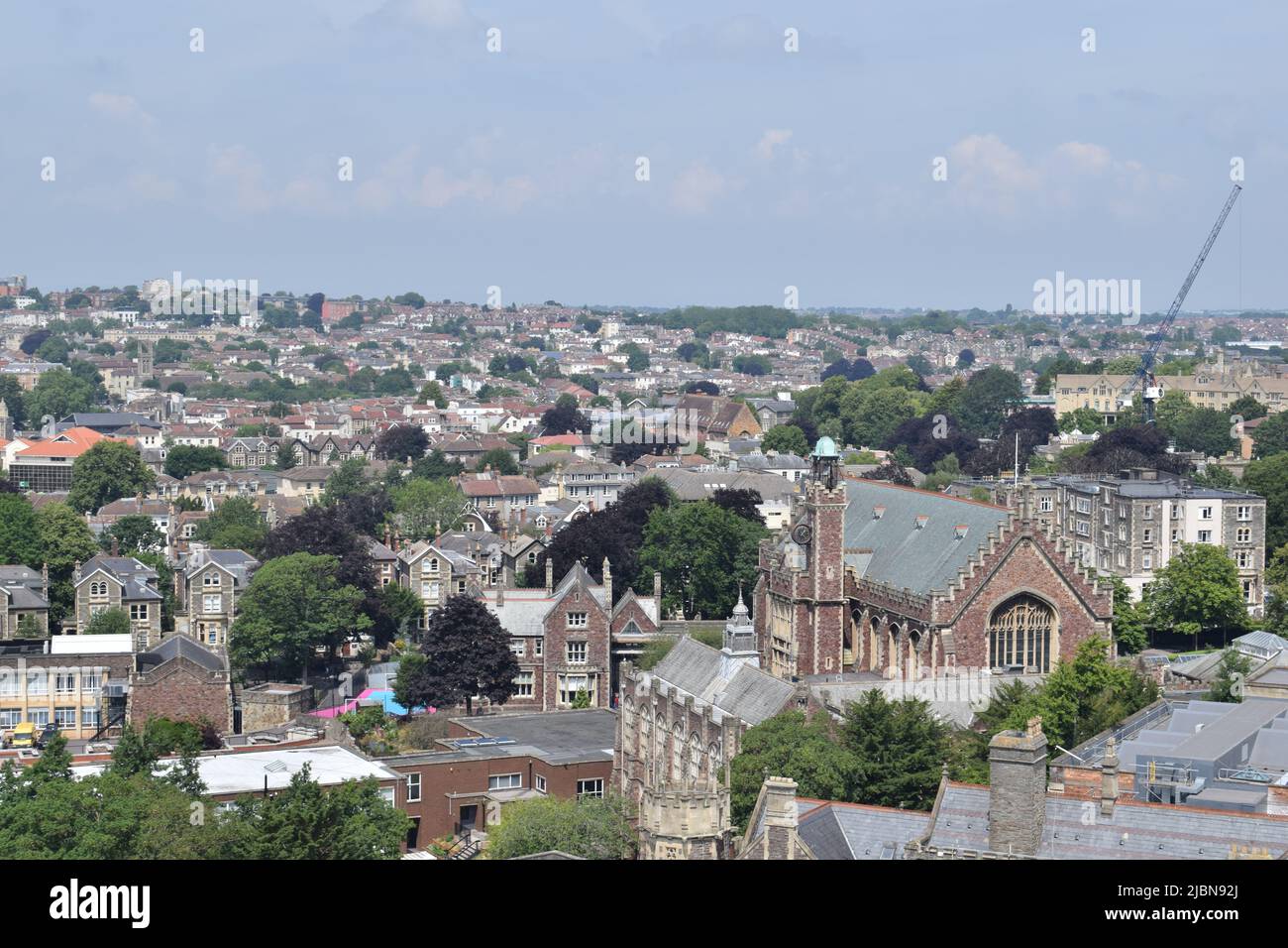 Aerial view of Bristol city during sunny day with sky and clouds. Many ...