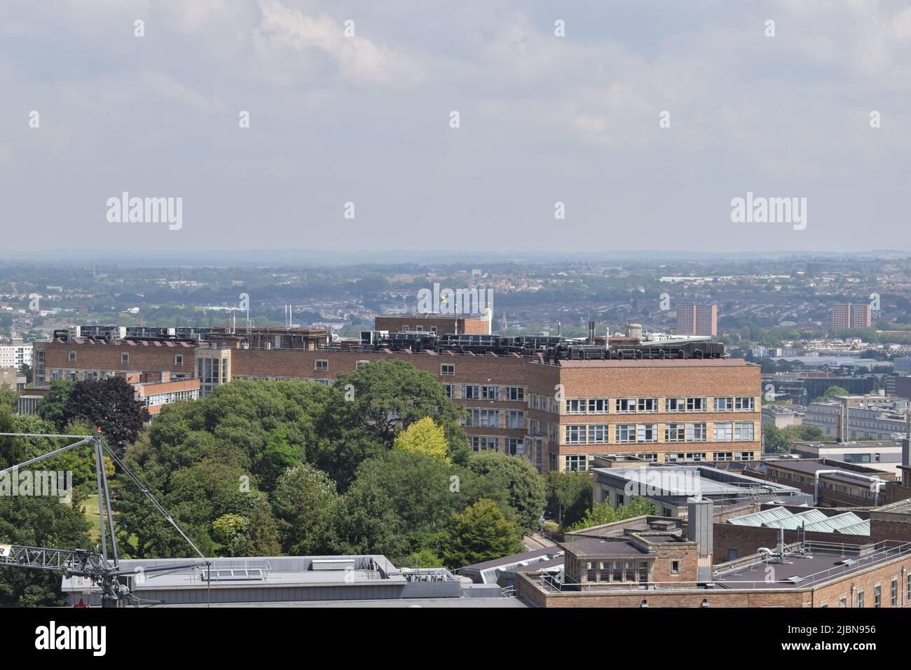 Aerial view of Bristol city during sunny day with sky and clouds. Many ...