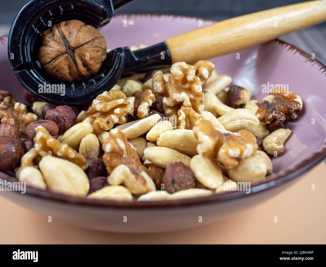 Mix nuts on a wooden background. High quality photo Stock Photo - Alamy