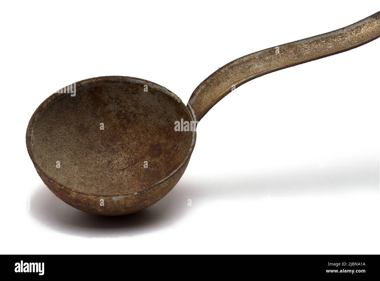 Extreme close up of front part of rusty old ladle as kitchen helper on ...