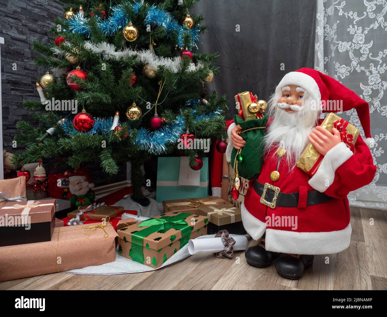 Christmas gifts under the tree Stock Photo - Alamy