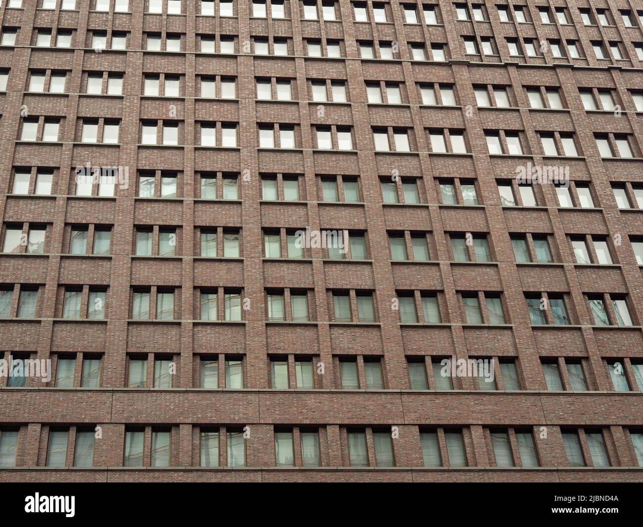 Facade of a high rise building. Brick facade Stock Photo - Alamy