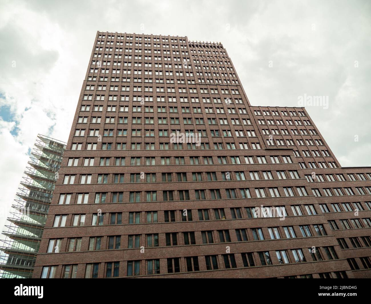 Facade of a high rise building. Brick facade Stock Photo - Alamy