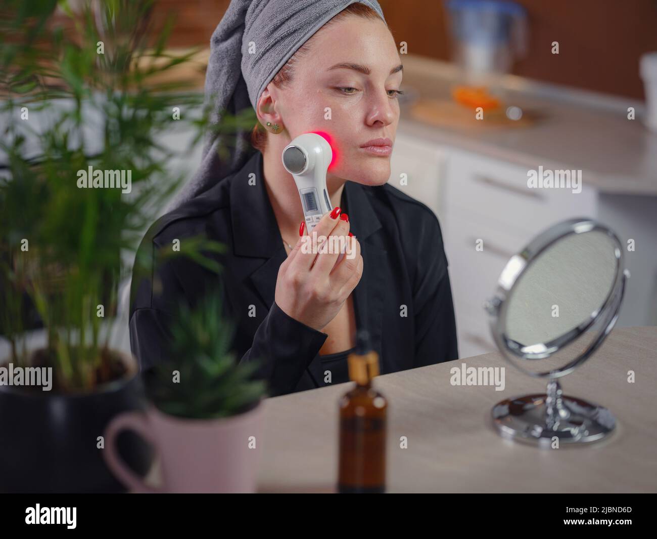 Young woman use Ultrasonic Skin Scrubber Exfoliating Wand. Skin care ...