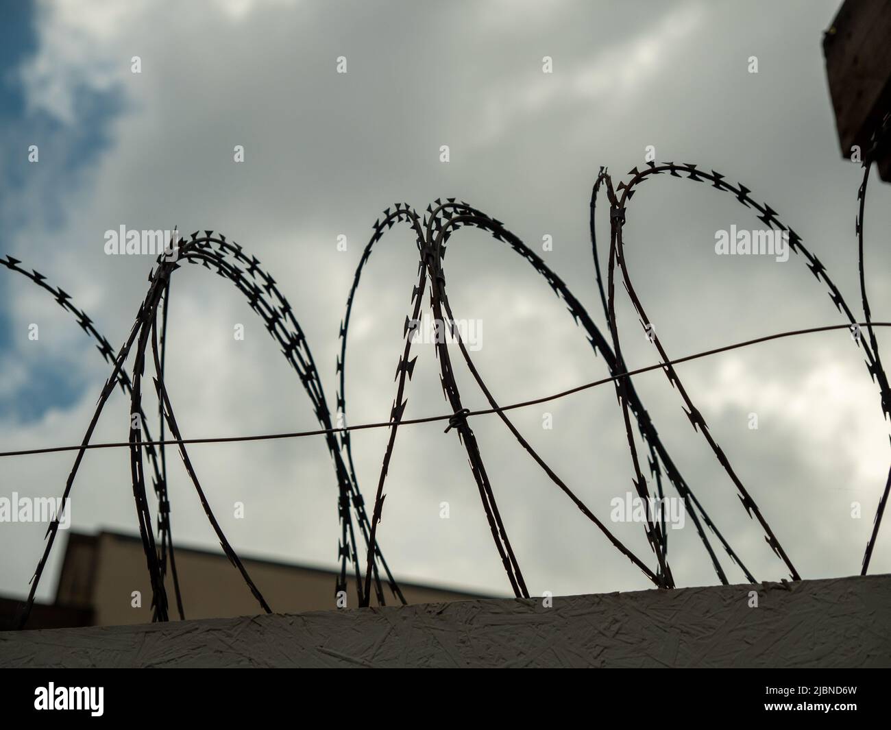 Barbed wire. Barbed wire against the sky Stock Photo - Alamy