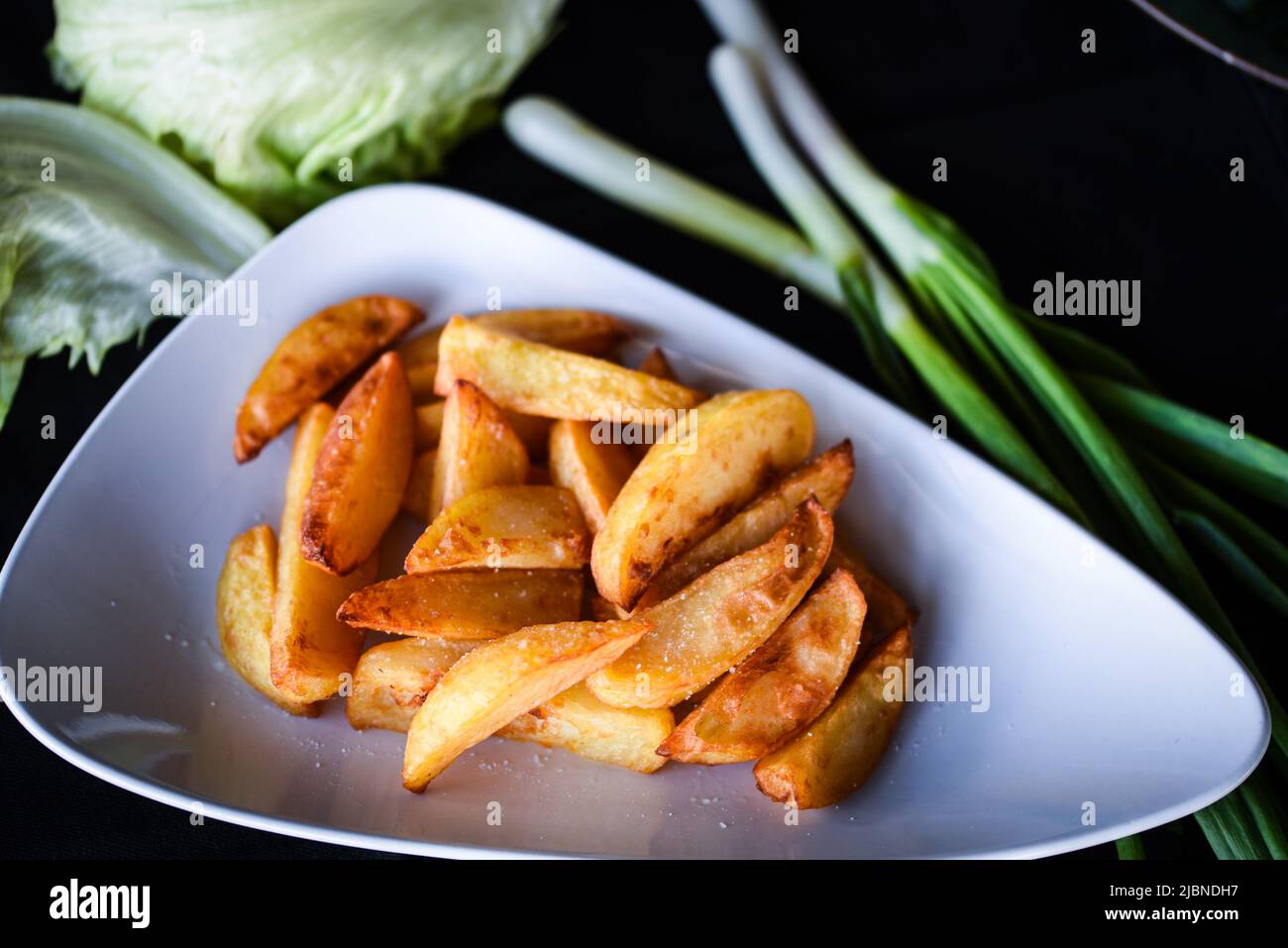 delicious home made wedges fries Stock Photo - Alamy
