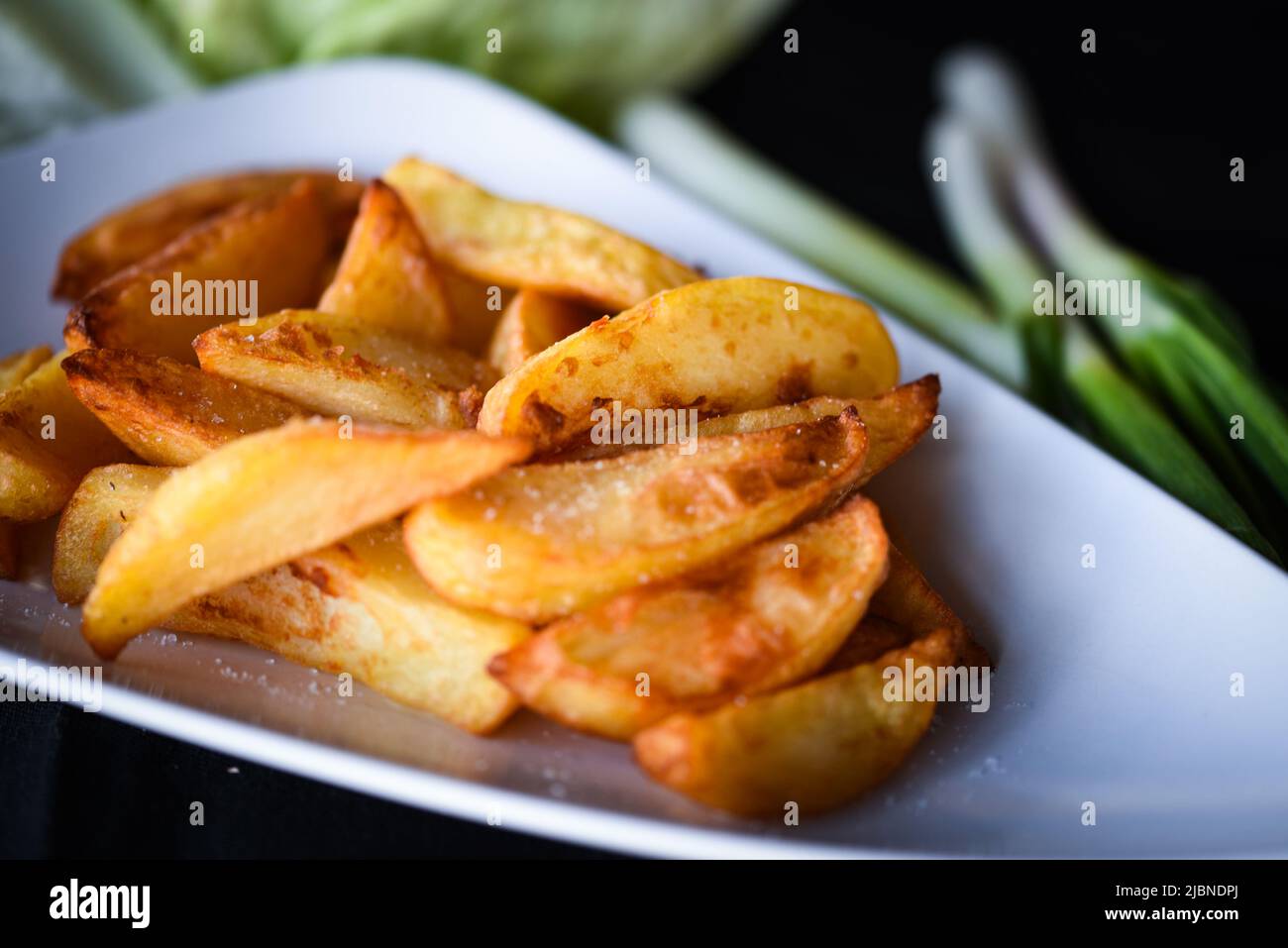 delicious home made wedges fries Stock Photo - Alamy