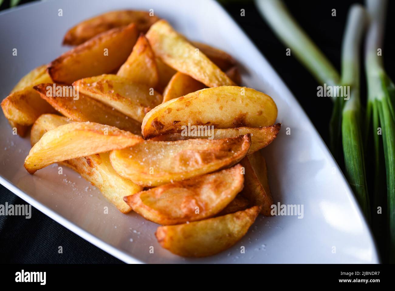 delicious home made wedges fries Stock Photo - Alamy