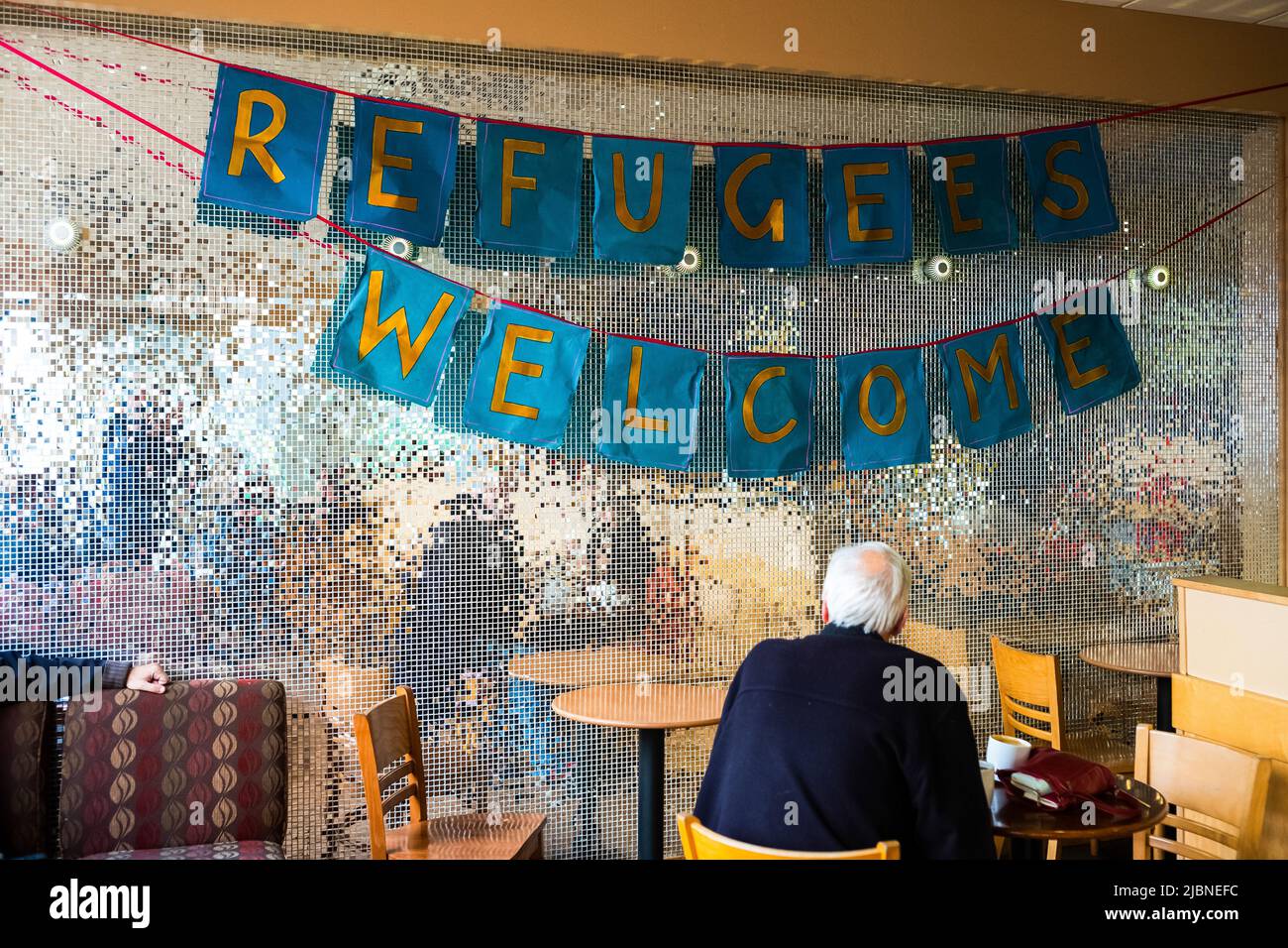 Inside a Brighton Cafe a message to refugees coming into the UK Stock ...