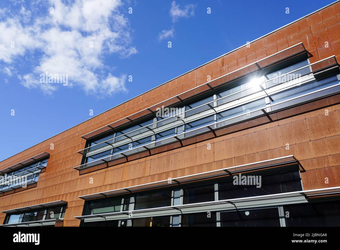 Rusted corten steel panels cladding facade of a modern design house on ...