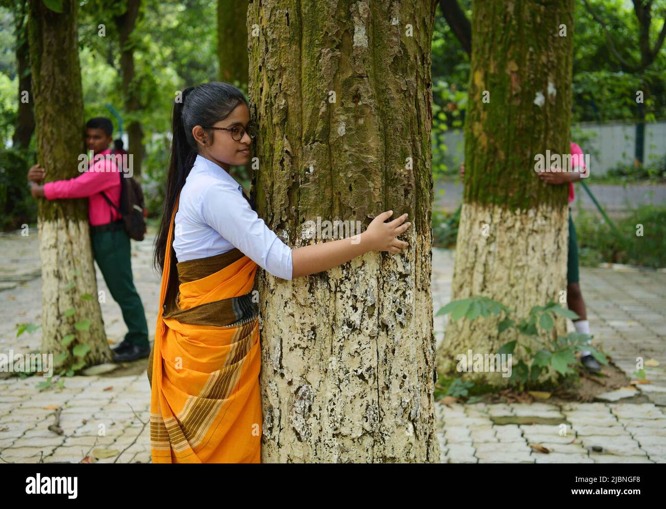 School children of Netaji Subhas Vidyaniketan pose and hug trees for ...