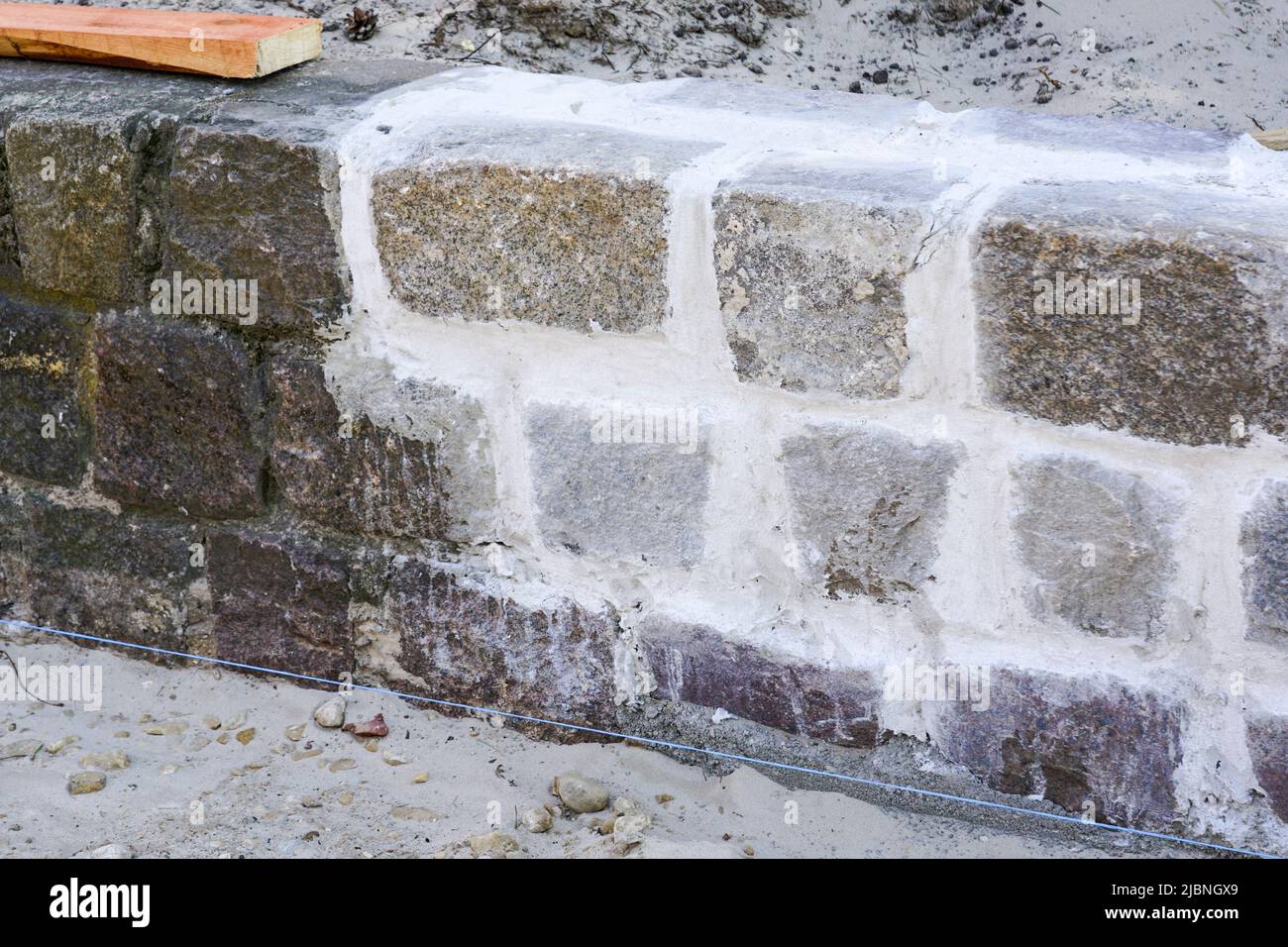 cleaning of cobblestone square stone walls and restoration of visual ...