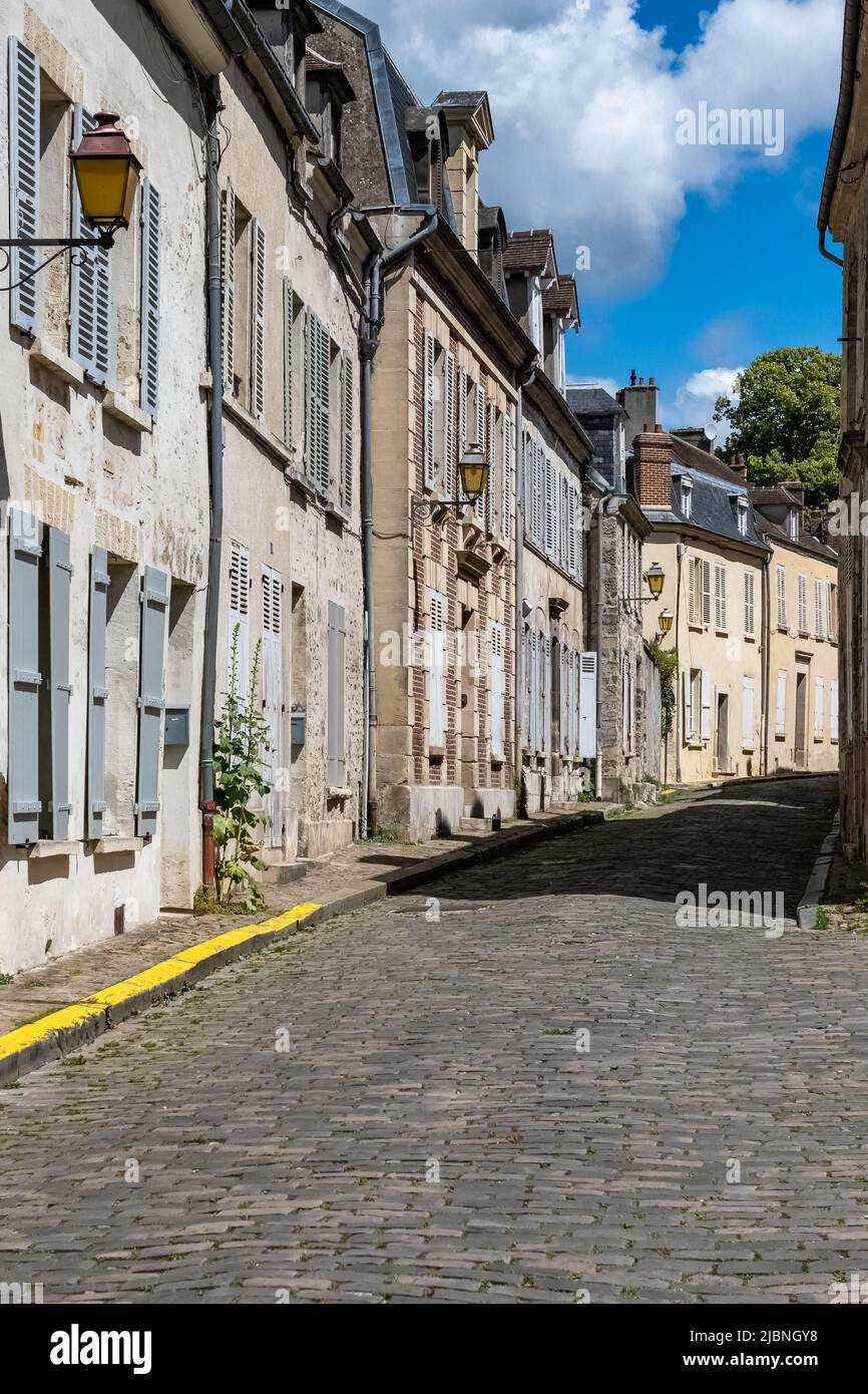 Senlis, medieval city in France, typical cobblestone street with ...