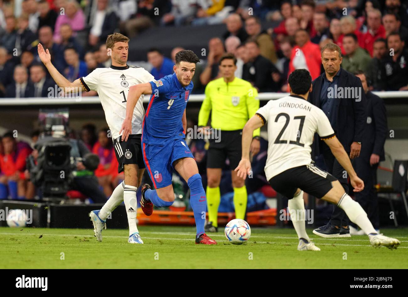 England's Declan Rice (centre) in action with Germany's Thomas Muller ...