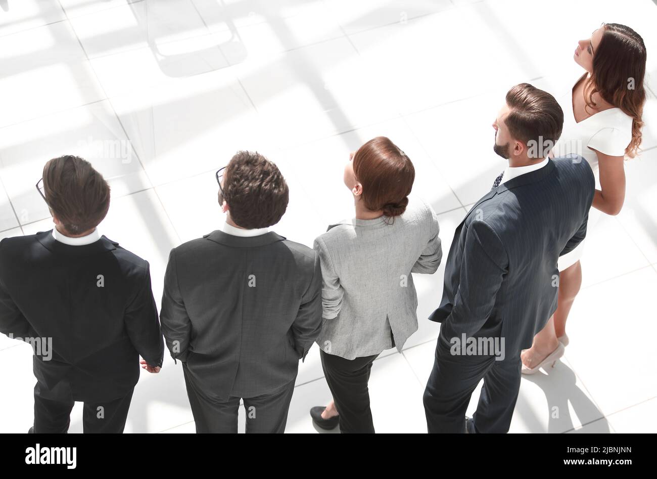 rear view.a group of business people standing together Stock Photo - Alamy