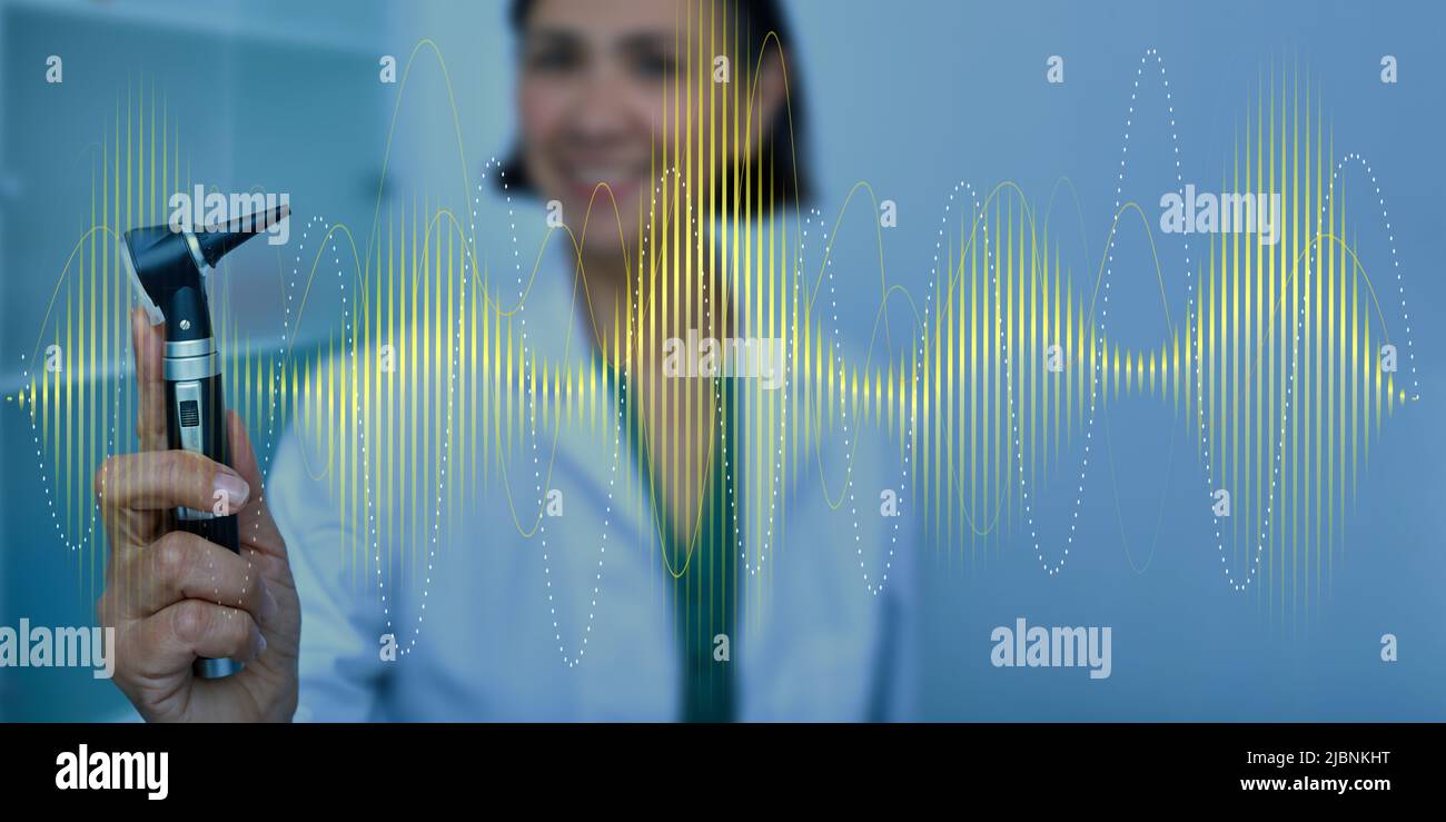 Audiologist with otoscope on sound waves background. Hearing treatment ...