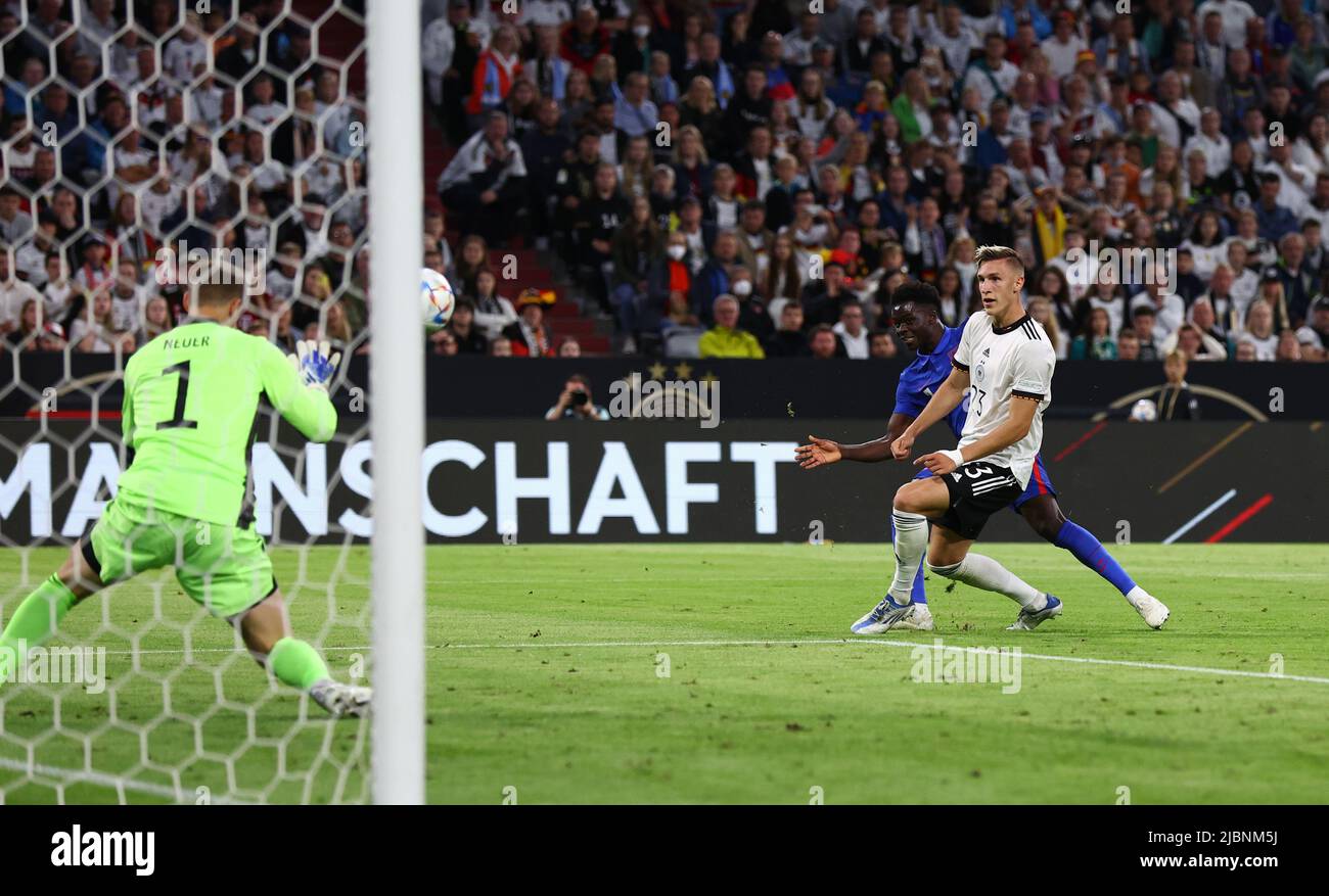 Munich, Germany, 7th June 2022. Bukayo Saka of England takes shot which ...