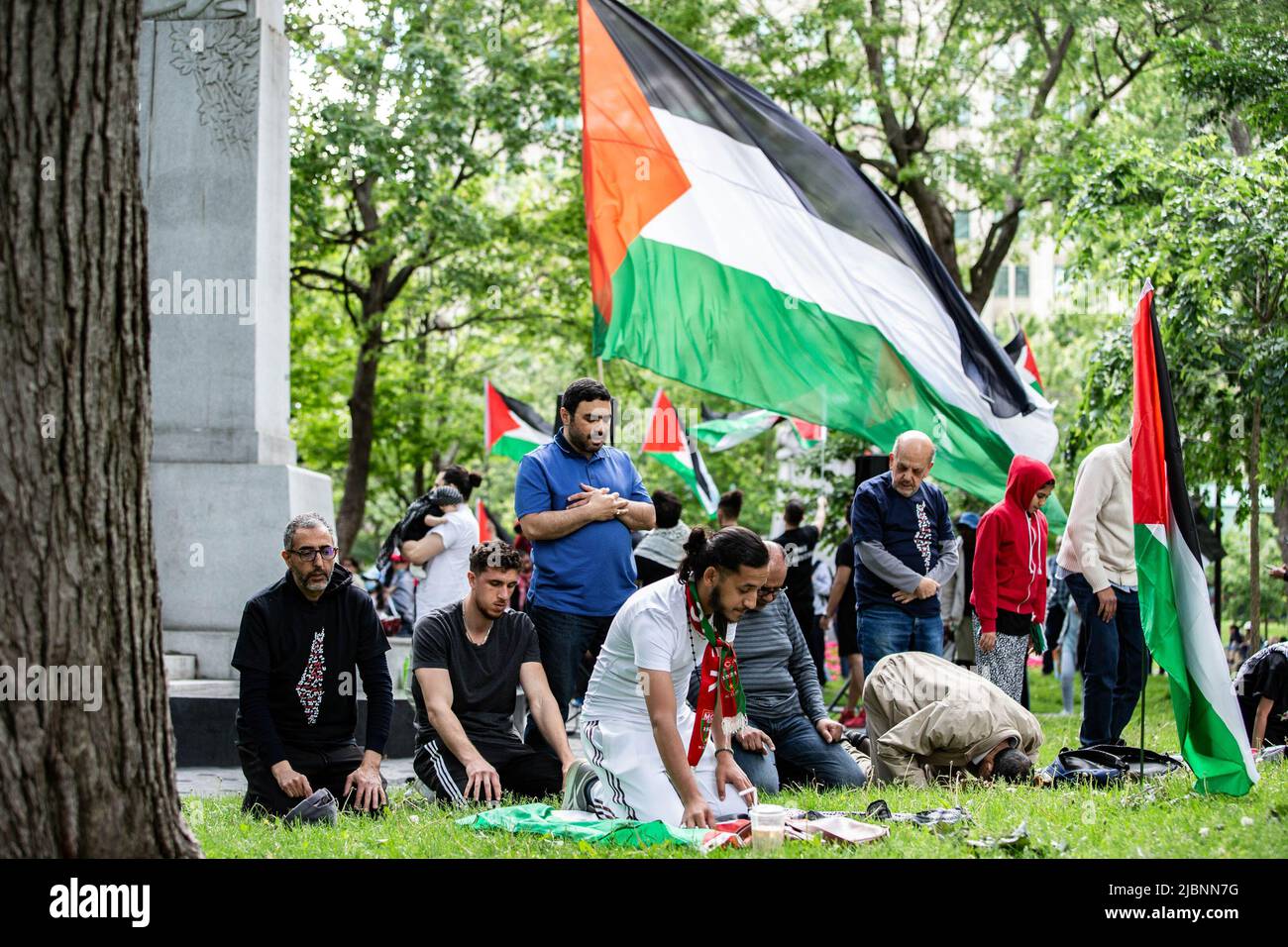 Palestinian demonstrators take a moment to pray during the protest ...