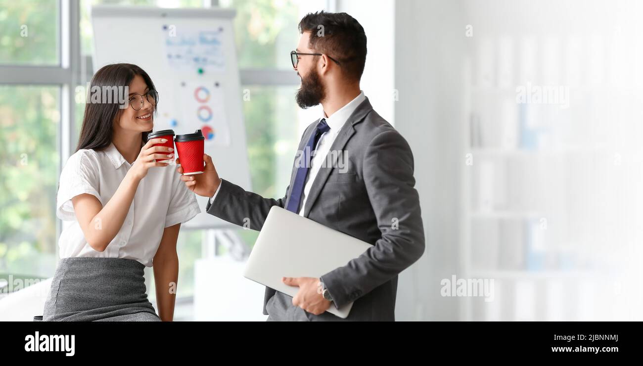 Business people having coffee break in office Stock Photo - Alamy