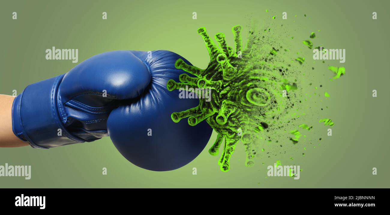 Hand in boxing glove kicking cigarette on green background. Concept of ...
