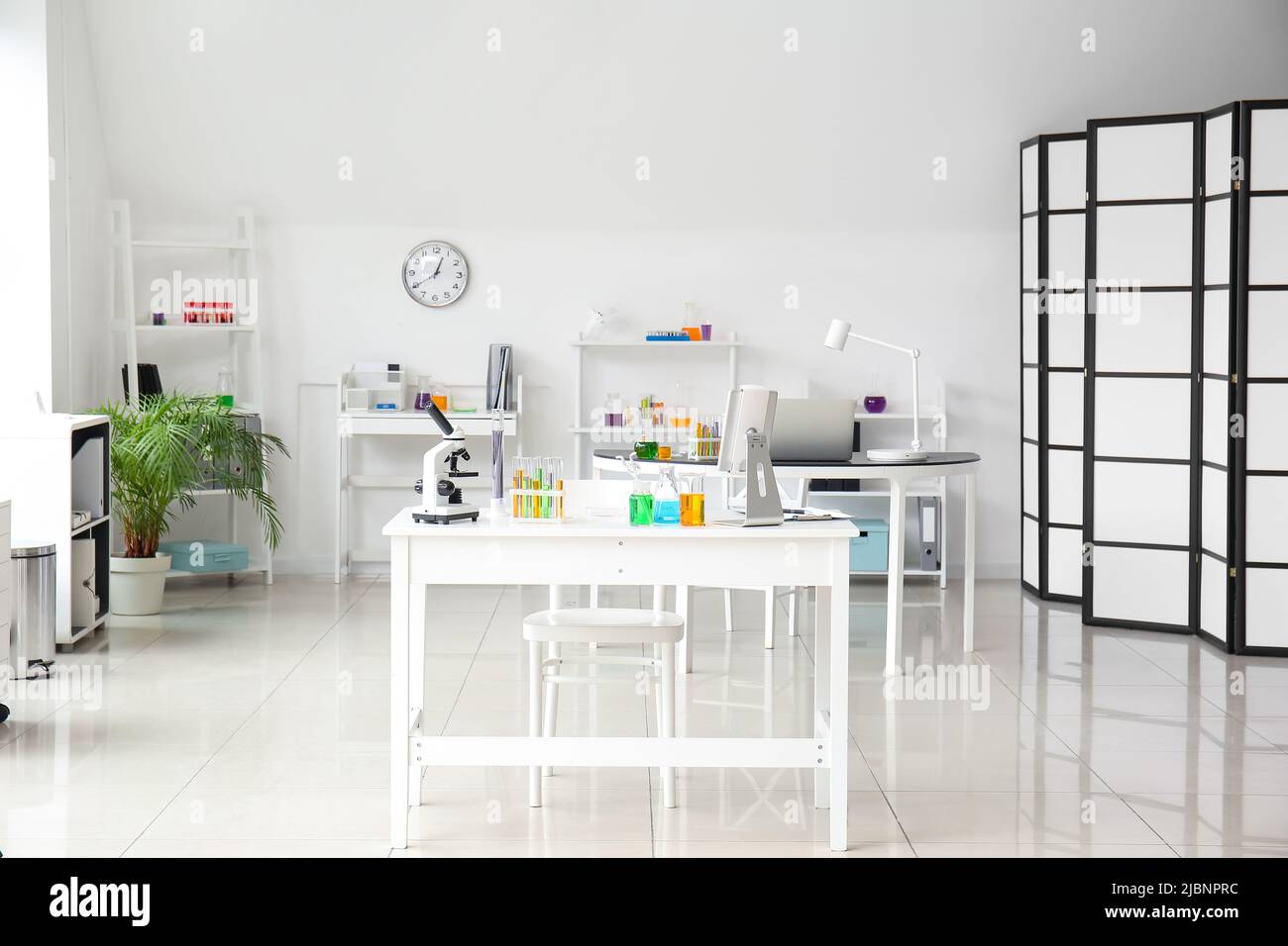 Interior of medical laboratory with modern workplace, microscope and ...