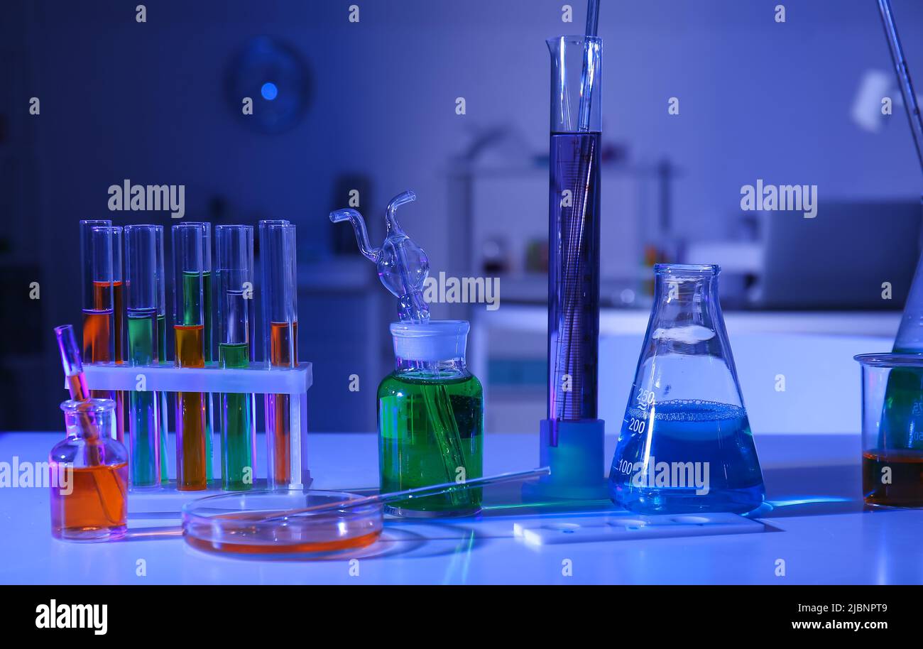Chemical glassware on table in medical laboratory Stock Photo - Alamy