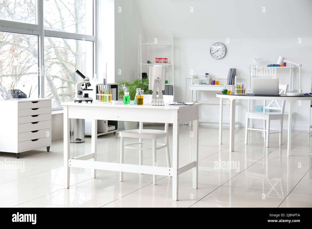 Interior of medical laboratory with modern workplace, microscope and ...