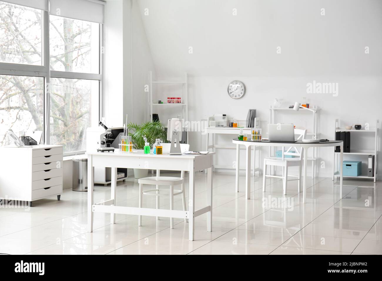 Interior of medical laboratory with modern workplace, microscope and ...