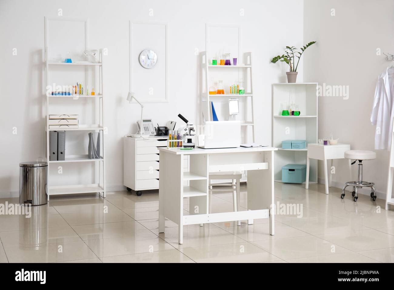 Interior of medical laboratory with modern workplace, microscope and ...