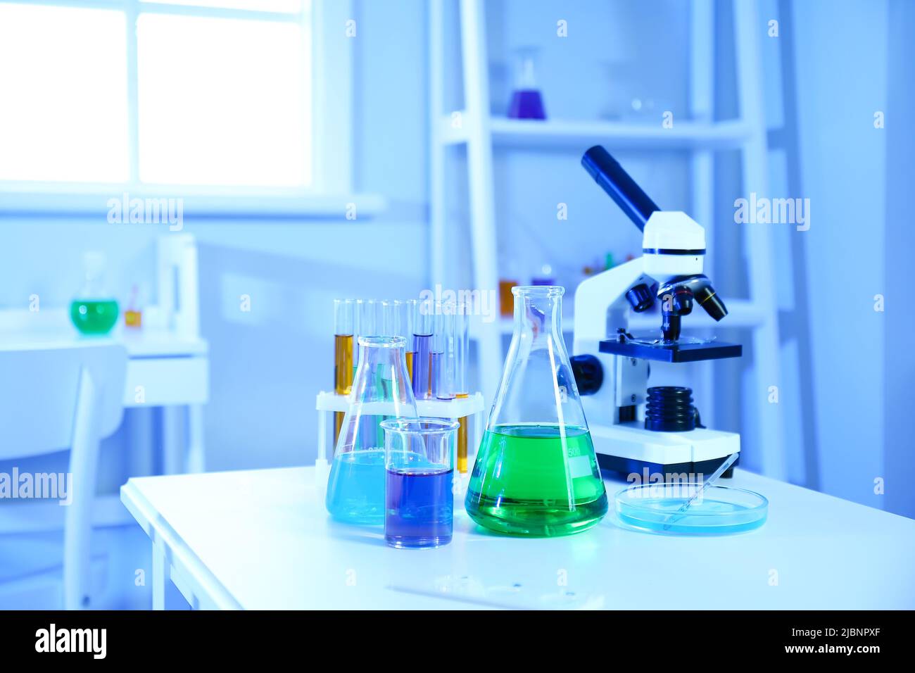 Chemical glassware with samples on table in medical laboratory Stock ...