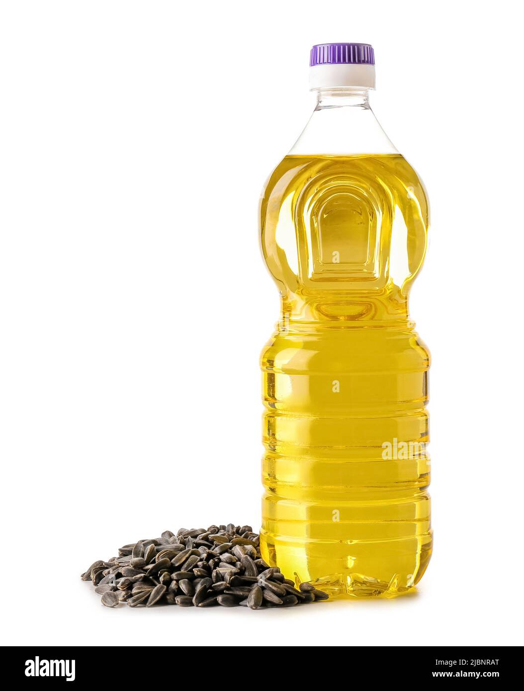 Bottle of fresh oil and sunflower seeds on white background Stock Photo ...