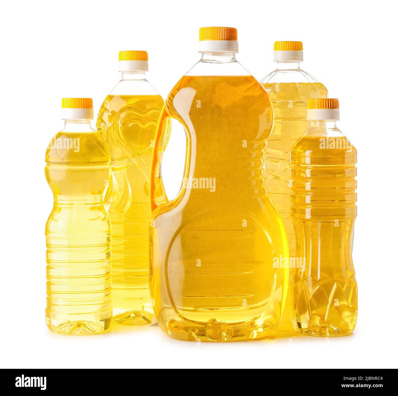 Different bottles of fresh sunflower oil on white background Stock ...