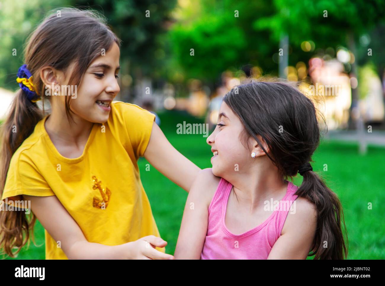 girlfriends children hugging in the park.selective focus.kids Stock ...