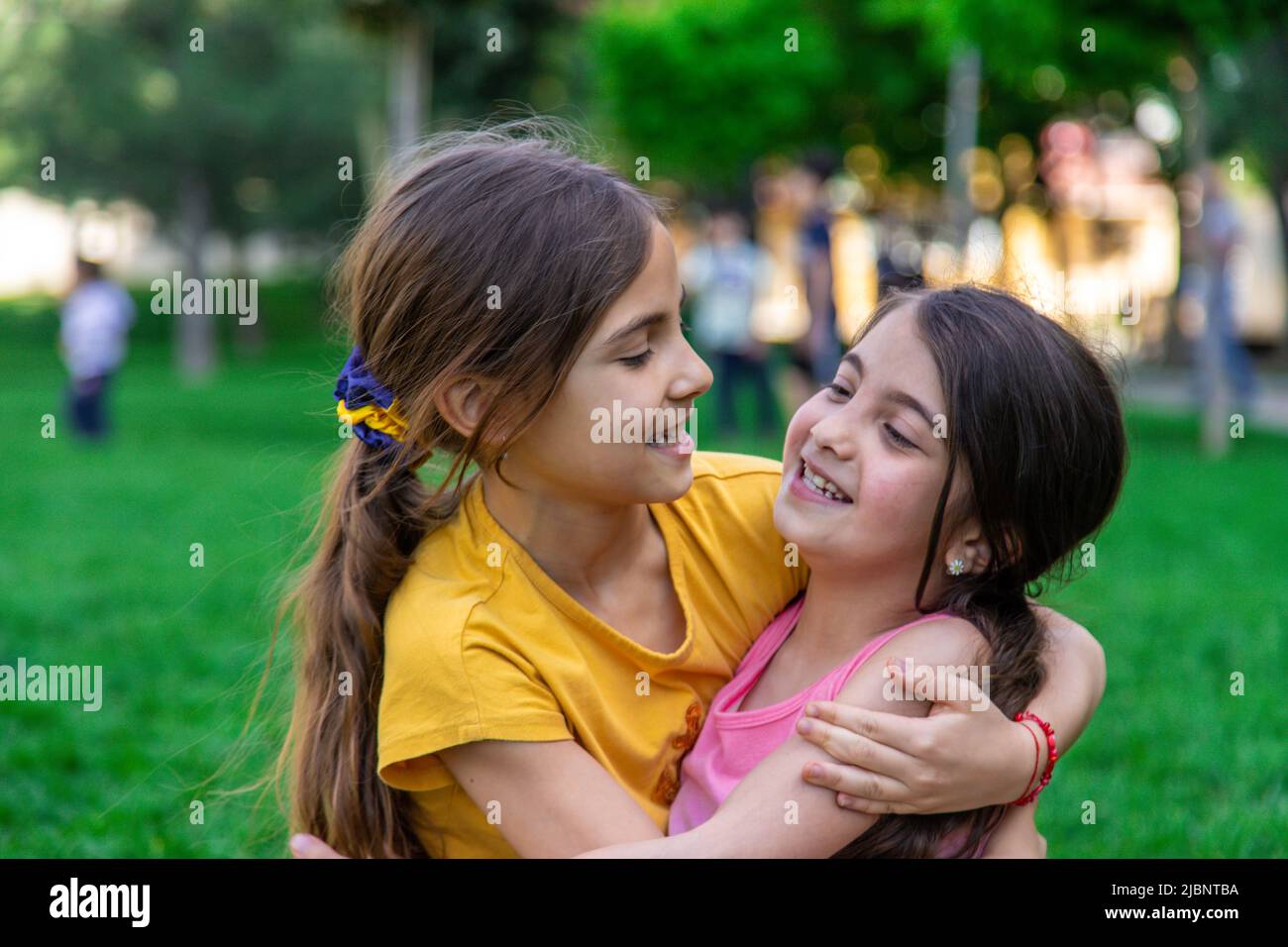 girlfriends children hugging in the park.selective focus.kids Stock ...