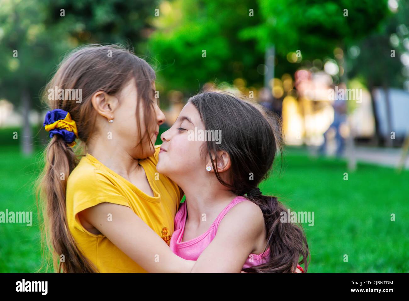 girlfriends children hugging in the park.selective focus.kids Stock ...