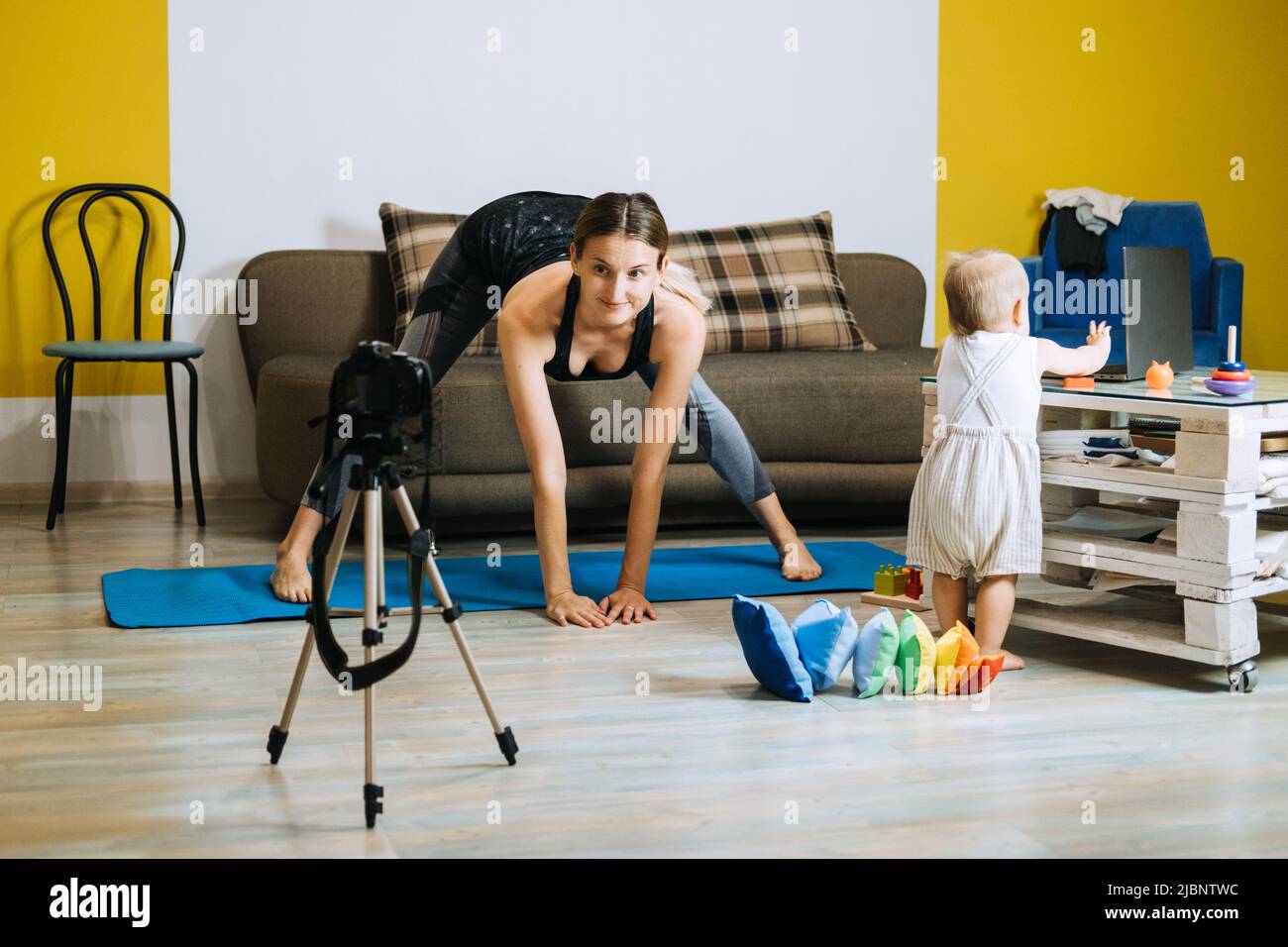 Young mother fitness instructor personal trainer record video near ...