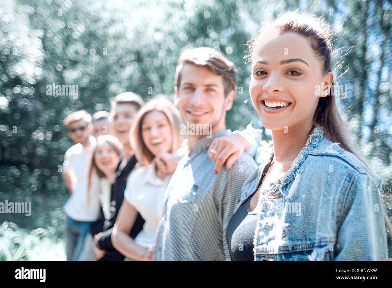 side view of a group of serious young men standing together Stock Photo ...