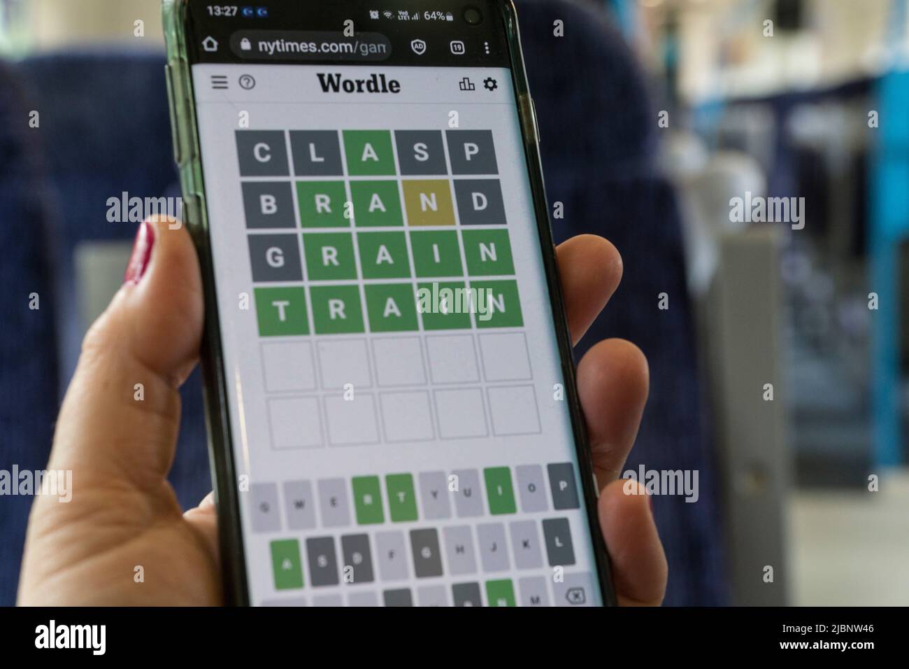 A Wordle puzzle on a train journey has the solution 'train' Stock Photo ...
